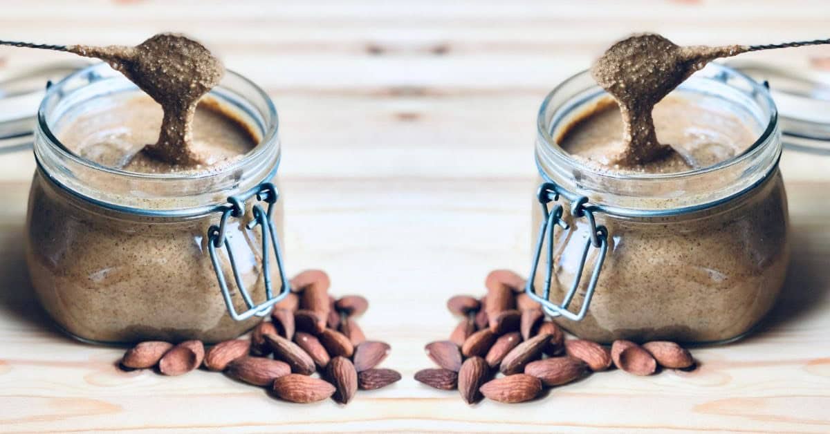 Homemade natural almond butter with roasted almonds